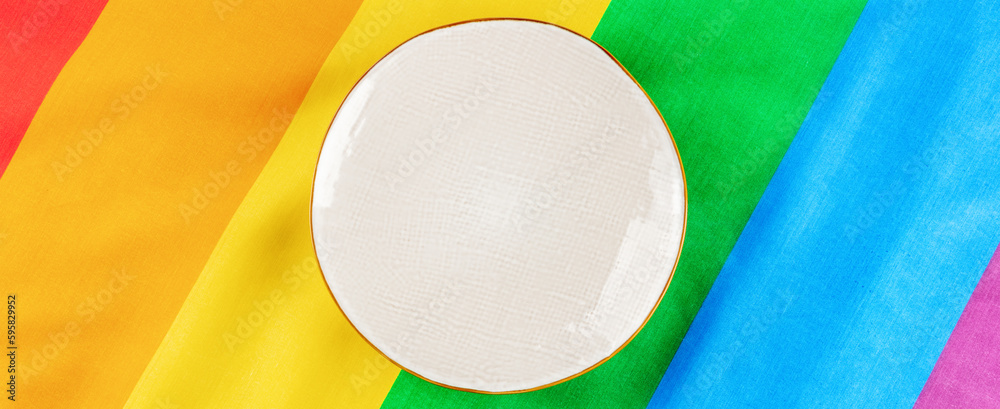 Gay food panorama. A plate, overhead flat lay shot on the LGBT rainbow ...