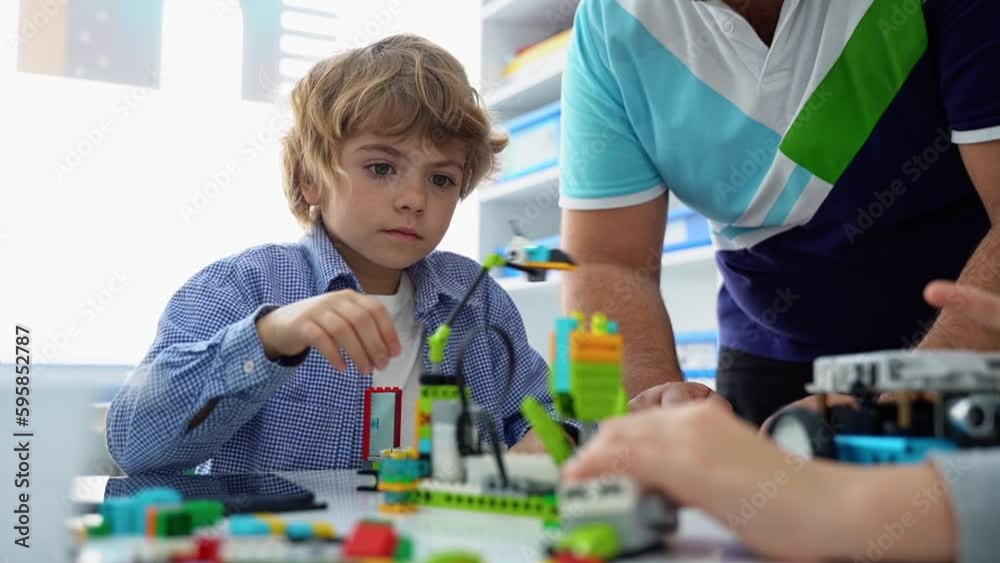 Robotics programming class. Children construct and code Robot. STEM ... Robotics programming class. Children construct and code Robot. STEM ...