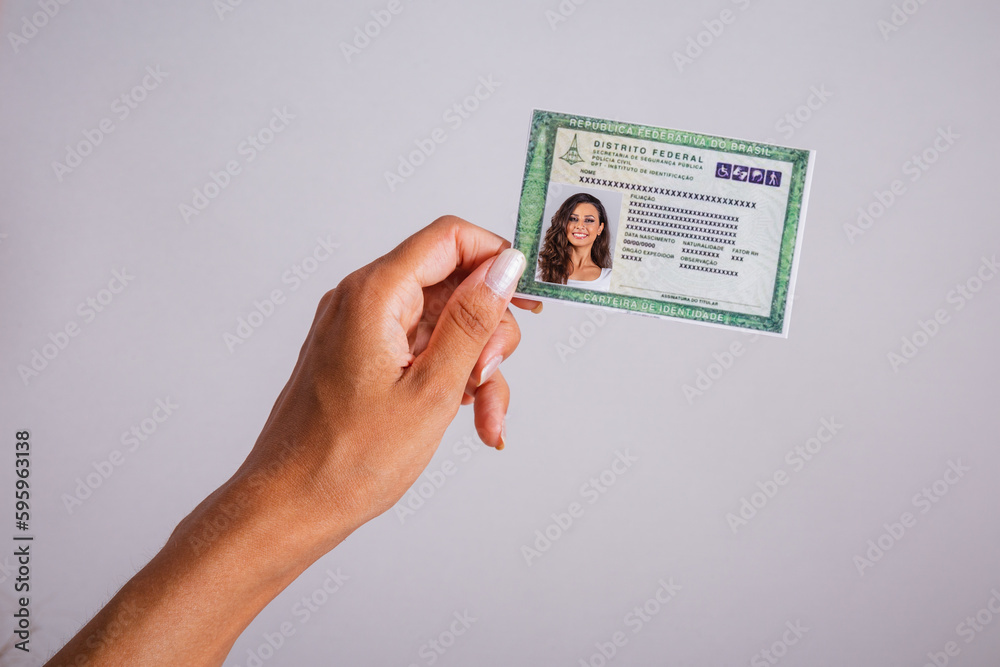 Hand holding identity card. document. Brazilian. Stock Photo | Adobe Stock