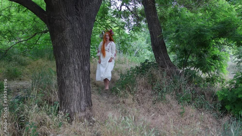 Paganism. Beautiful girl with long red hair with flower crown in ...