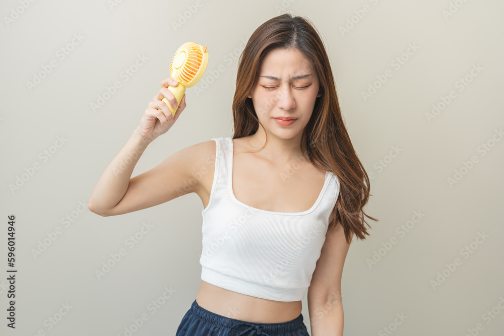 Suffering summer heat wave stroke, hot weather, tired asian young woman ...