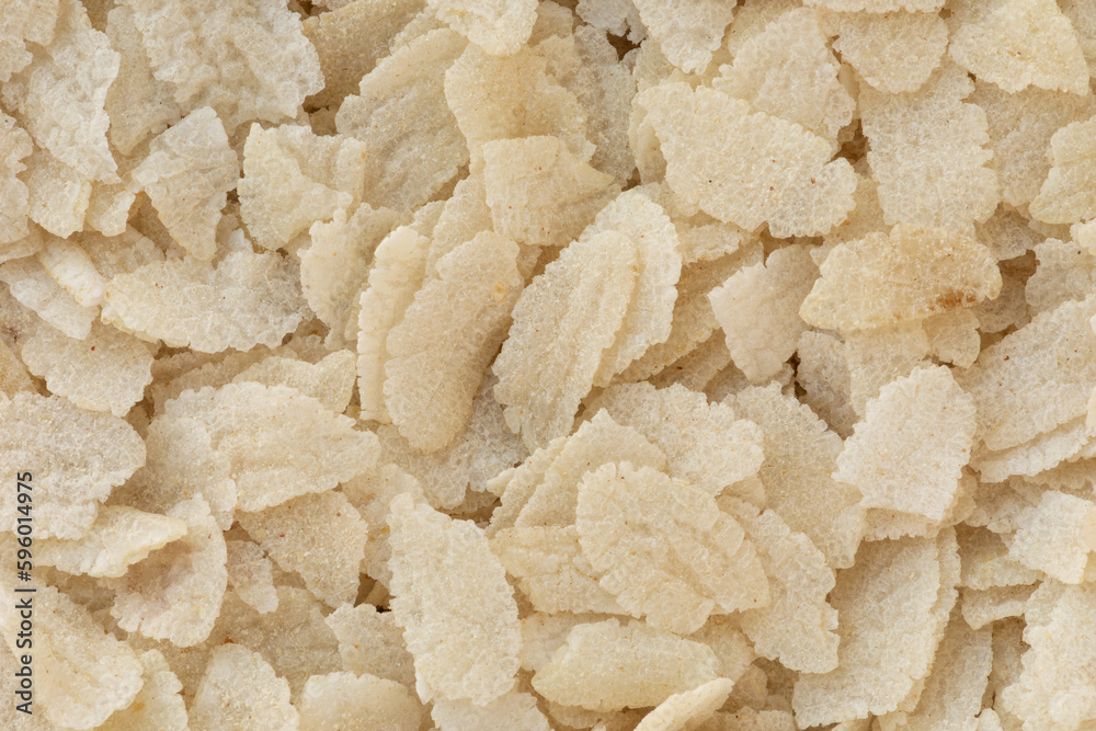 Poha, flattened rice background texture. Basis for Indian breakfast or ...