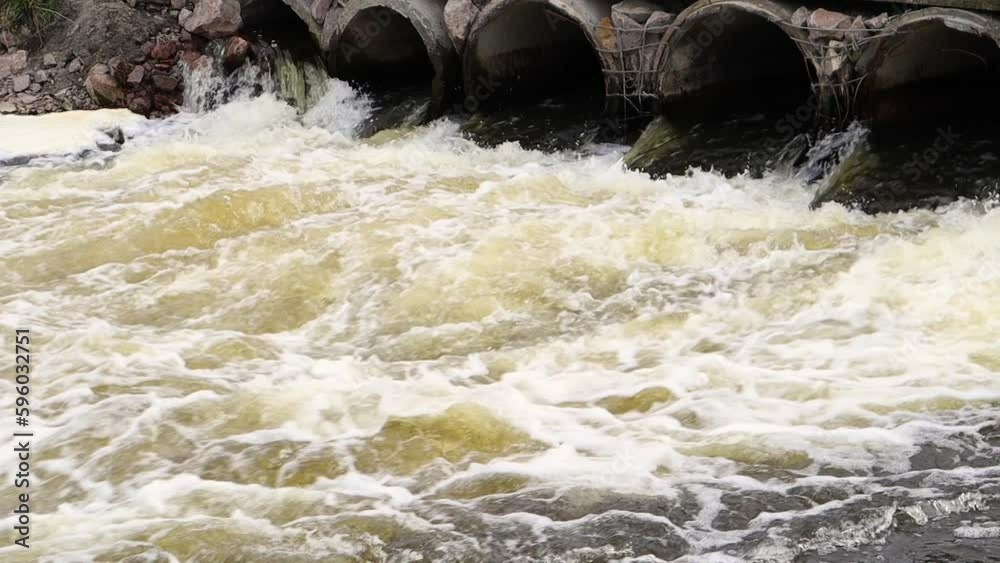 A concrete pipe that carries smelly, polluted sewage into the river ...
