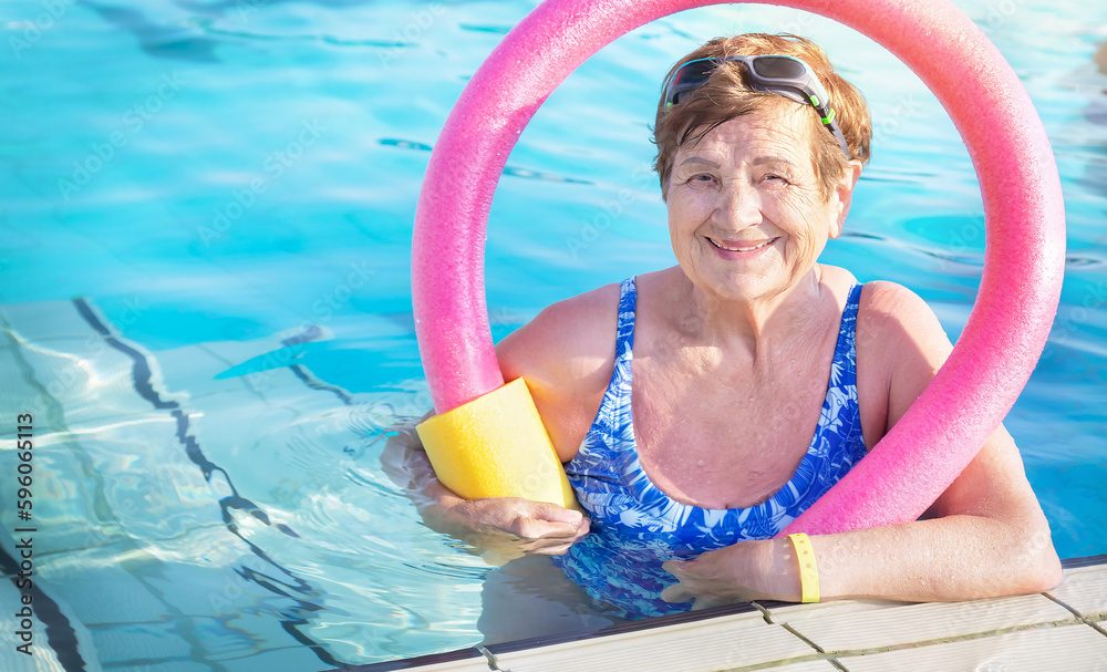 Active senior (elderly) woman (over age of 50) in sport goggles ...
