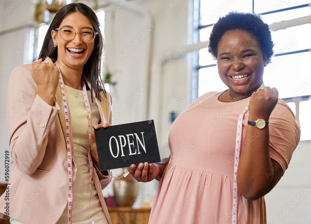 Its official. Were open. Cropped portrait of two attractive young ...