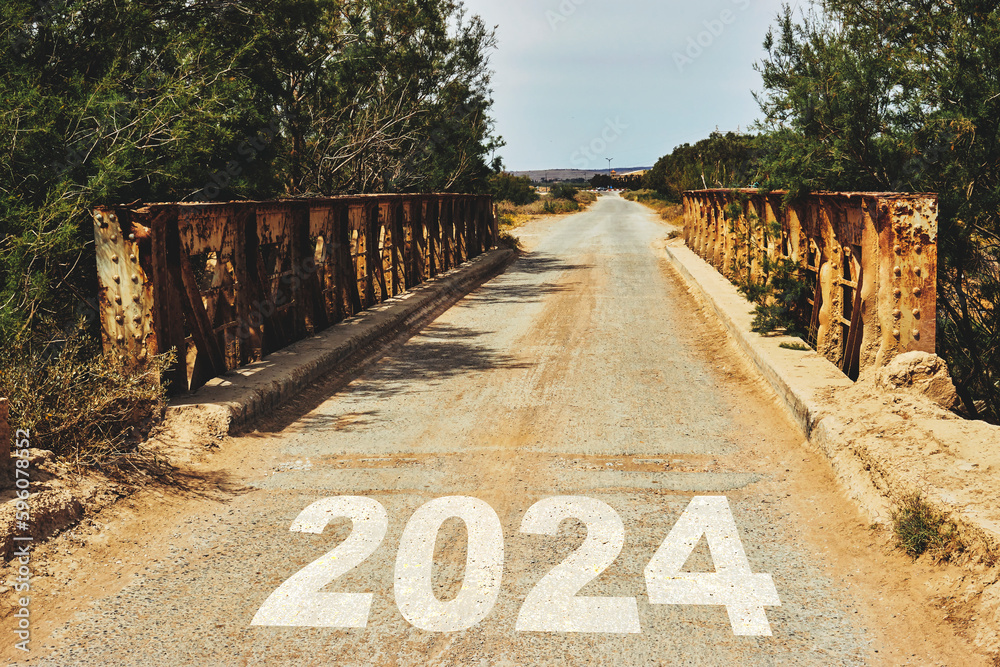 2024 written on highway road in the middle of empty asphalt road ...