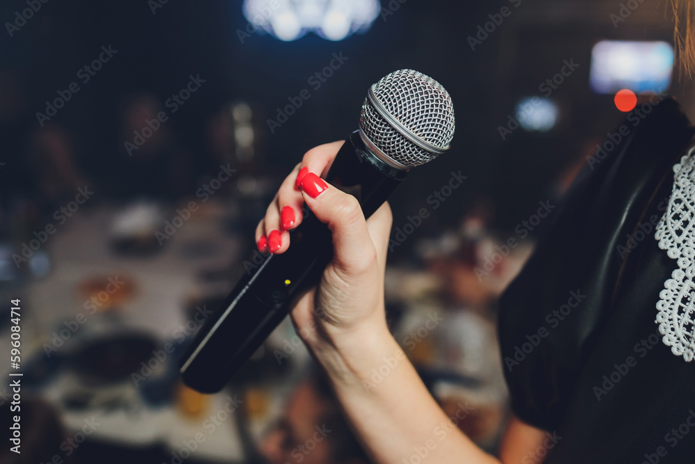 Girl Singing Into Microphone