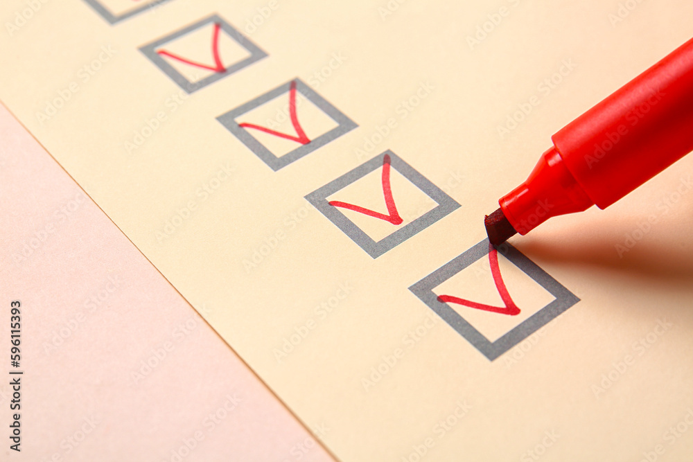 Red pen marking on checklist box, closeup Stock Photo | Adobe Stock