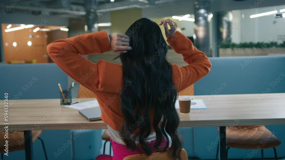 Unrecognizable young business woman with beautiful long dark hair with ...