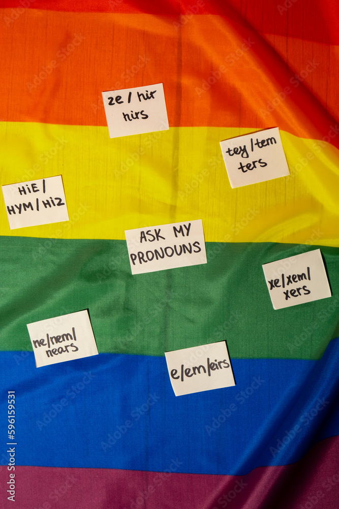 ASK MY PRONOUN Neo pronouns concept. Rainbow flag with paper notes text ...