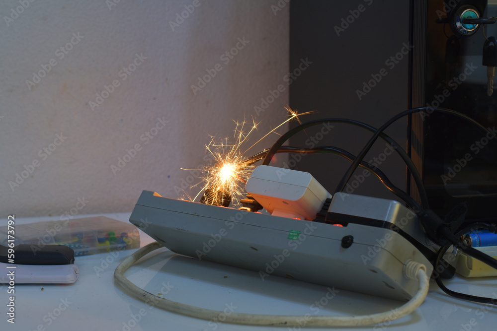 electrical plug sparking and burning Caused by a short circuit, concept ...
