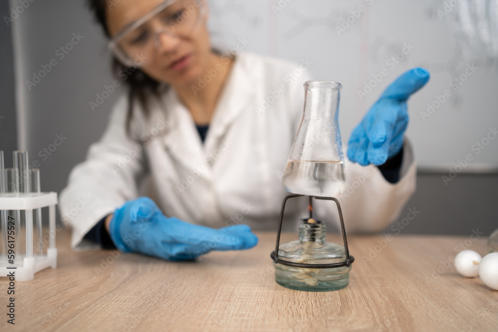 School chemistry classroom, teacher shows science experiment by setting ...