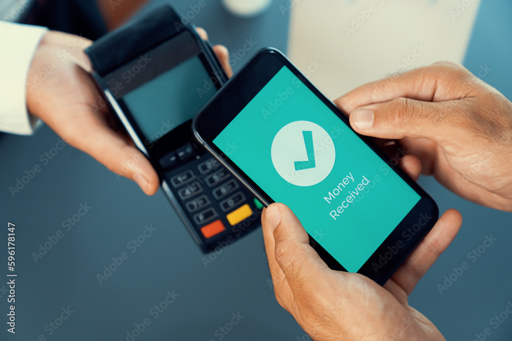 Hand holding smartphone with NFC QR code device, scanning contactless ...