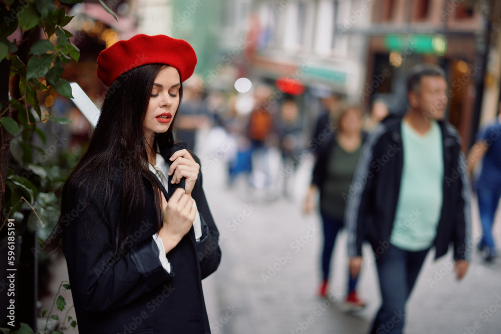 Photo & Art Print Woman walking down an old city street in a crowd ...