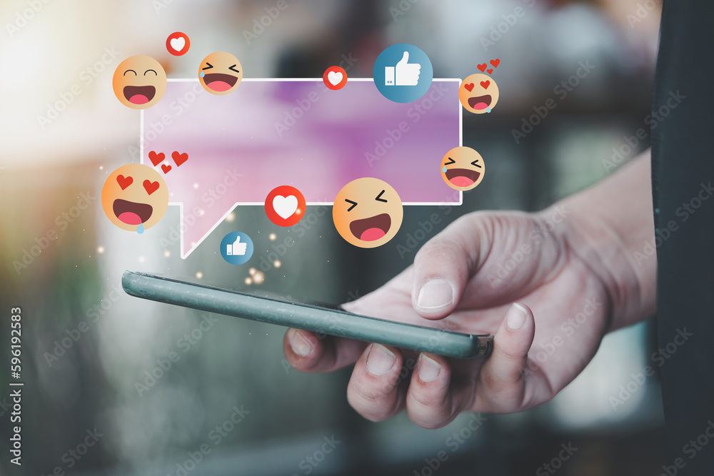 Text messages in cellphone screen with hologram speech bubbles and ...