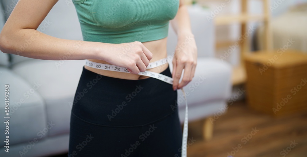 Asian woman with anorexia with measuring tape feeling unhappy. Anorexia ...