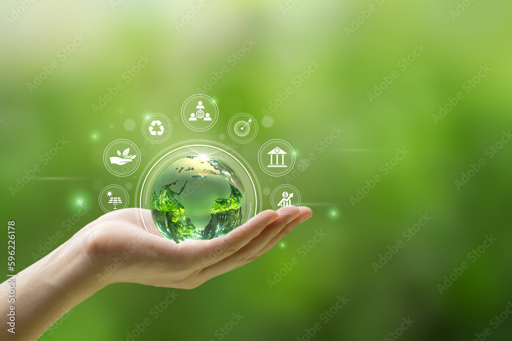 ESG environment social governance concept. Hand-holding crystal globe ...