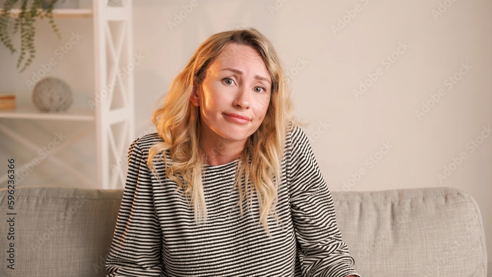 No idea. Confused woman. Uncertain situation. Smiling lady shrugging ...