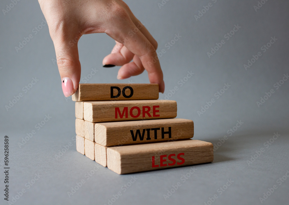 Do more with less symbol. Concept words Do more with less on wooden ...