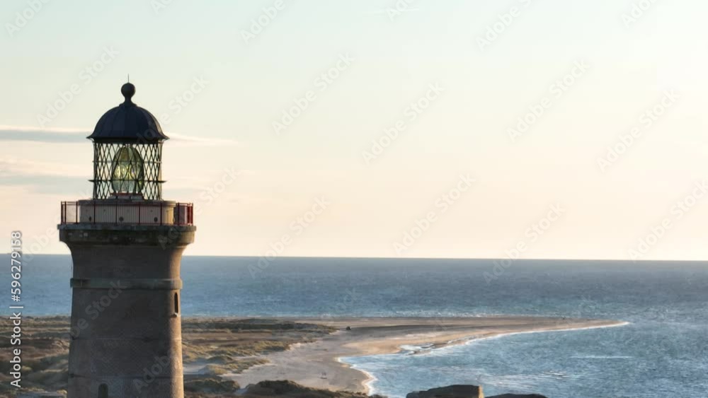 Aerial footage of coastline with the famous Skagen Grey Lighthouse ...