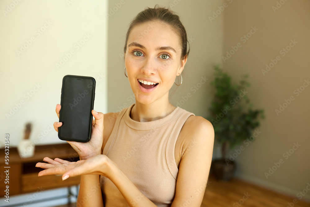 Cute happy friendly excited caucasian female advertising new mobile ...