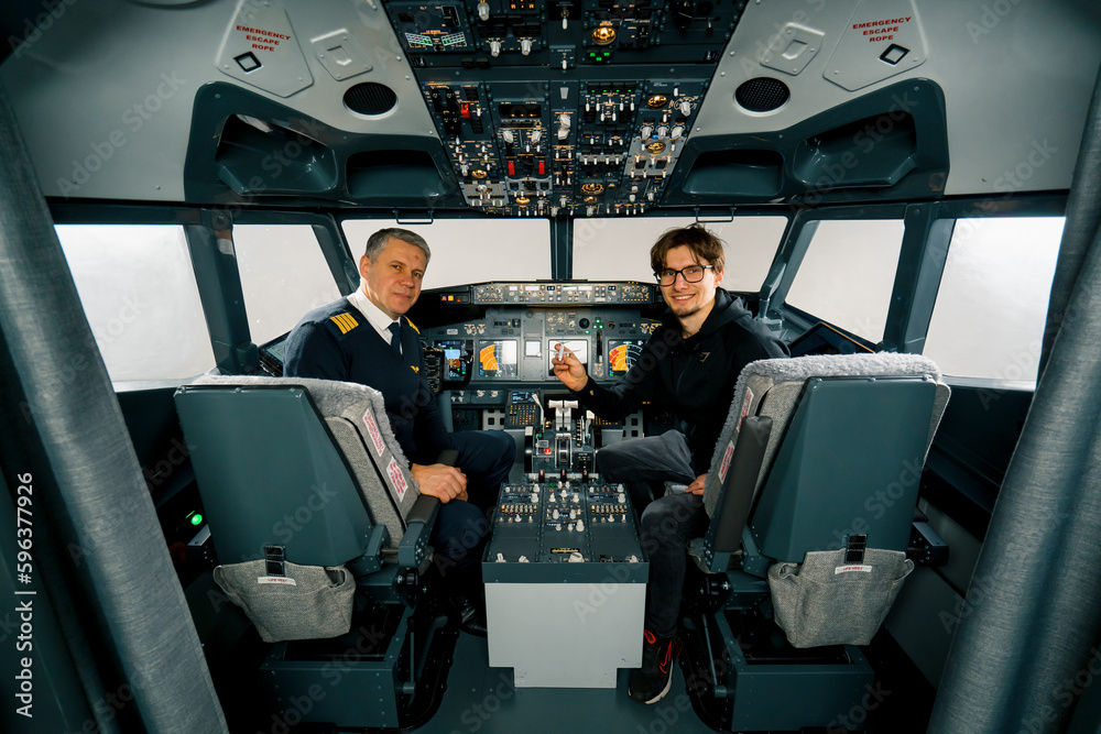 airplane cockpit pilot and young student boy smiling after training on ...