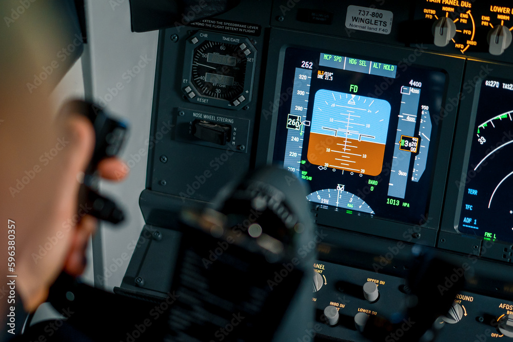A detailed shot of the control and navigation panel in the cockpit of a ...