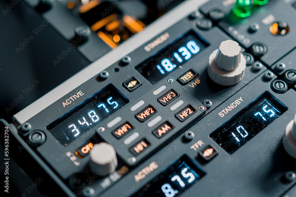 A detailed shot of the control and navigation panel in the cockpit of a ...