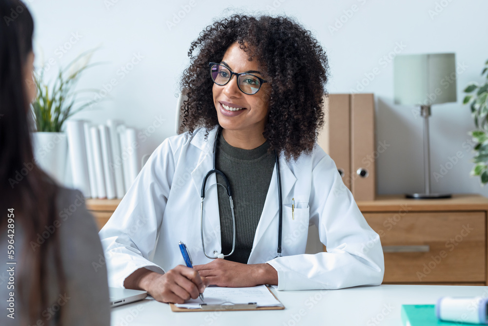 Beautiful cheerful female doctor talking while explaining medical ...
