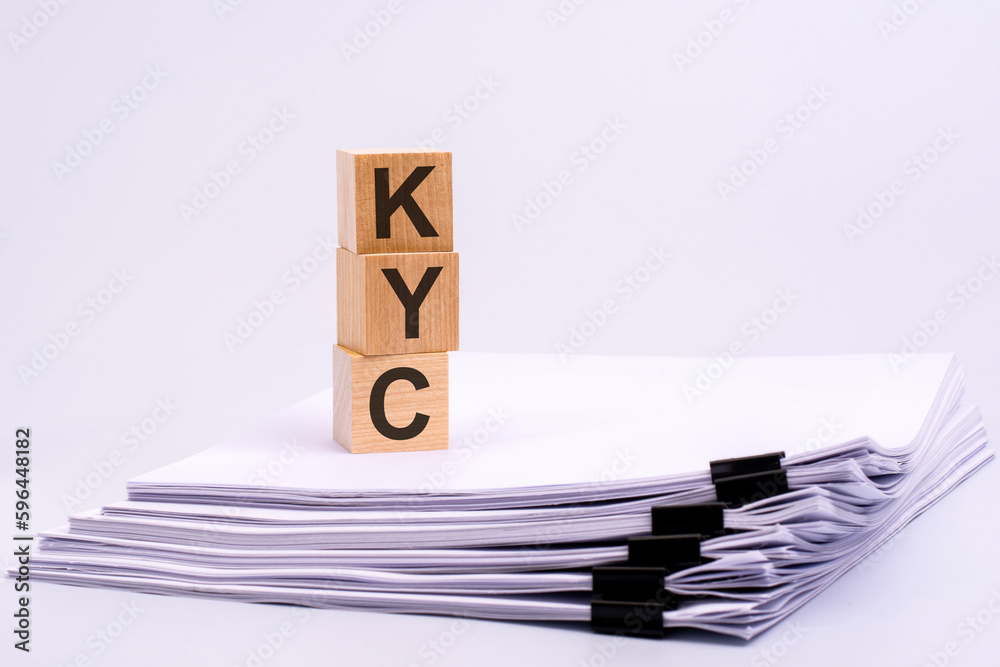 KYC - Know Your Customer. wooden cubes with word KYC. beautiful white ... KYC - Know Your Customer. wooden cubes with word KYC. beautiful white ...