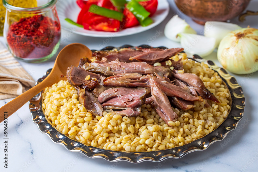Turkish foods; lamb shank tandoori on bulgur wheat rice (Turkish name ...