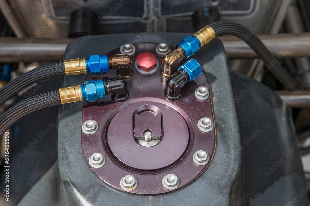 Photograph of the metal fuel cap and connecting hoses going into the ...