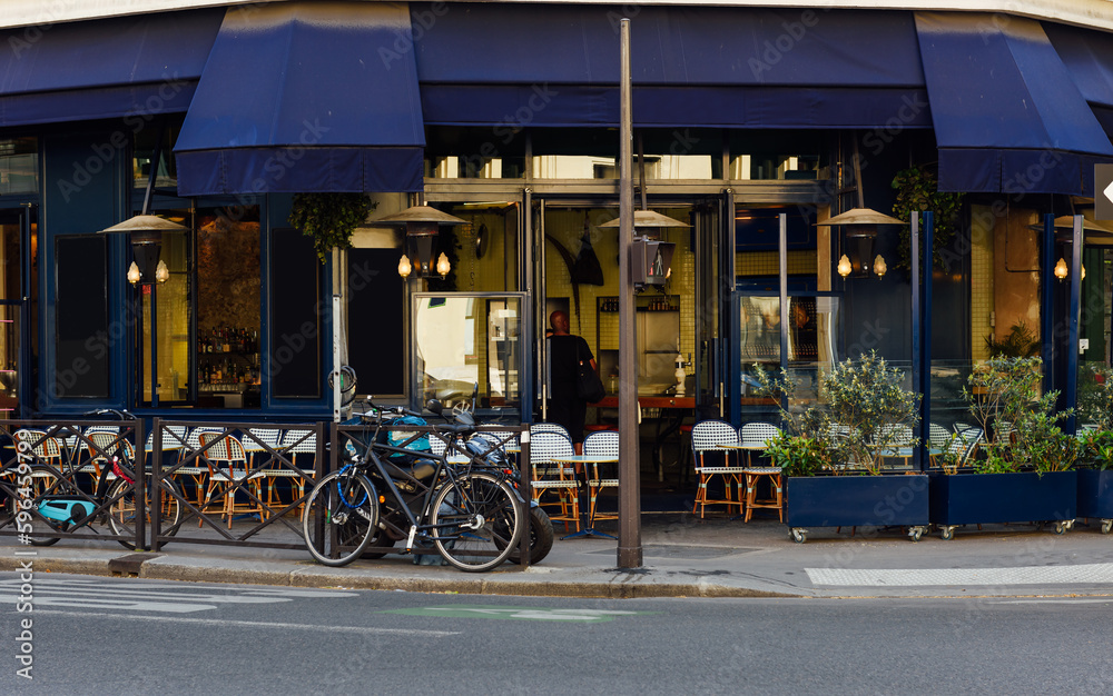 Typical view of street with tables of cafe in Paris, France. Cozy ...