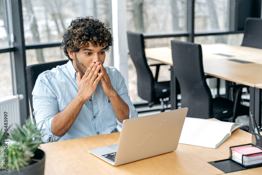 Shocked amazed indian or arabian businessman, company employee, ceo ...