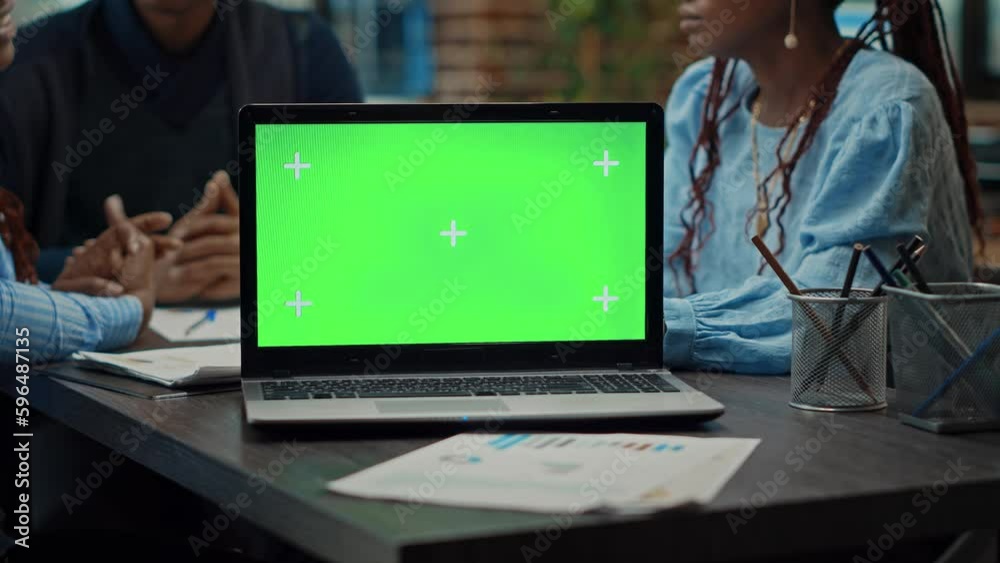 Business people working with greenscreen display on laptop, using ...
