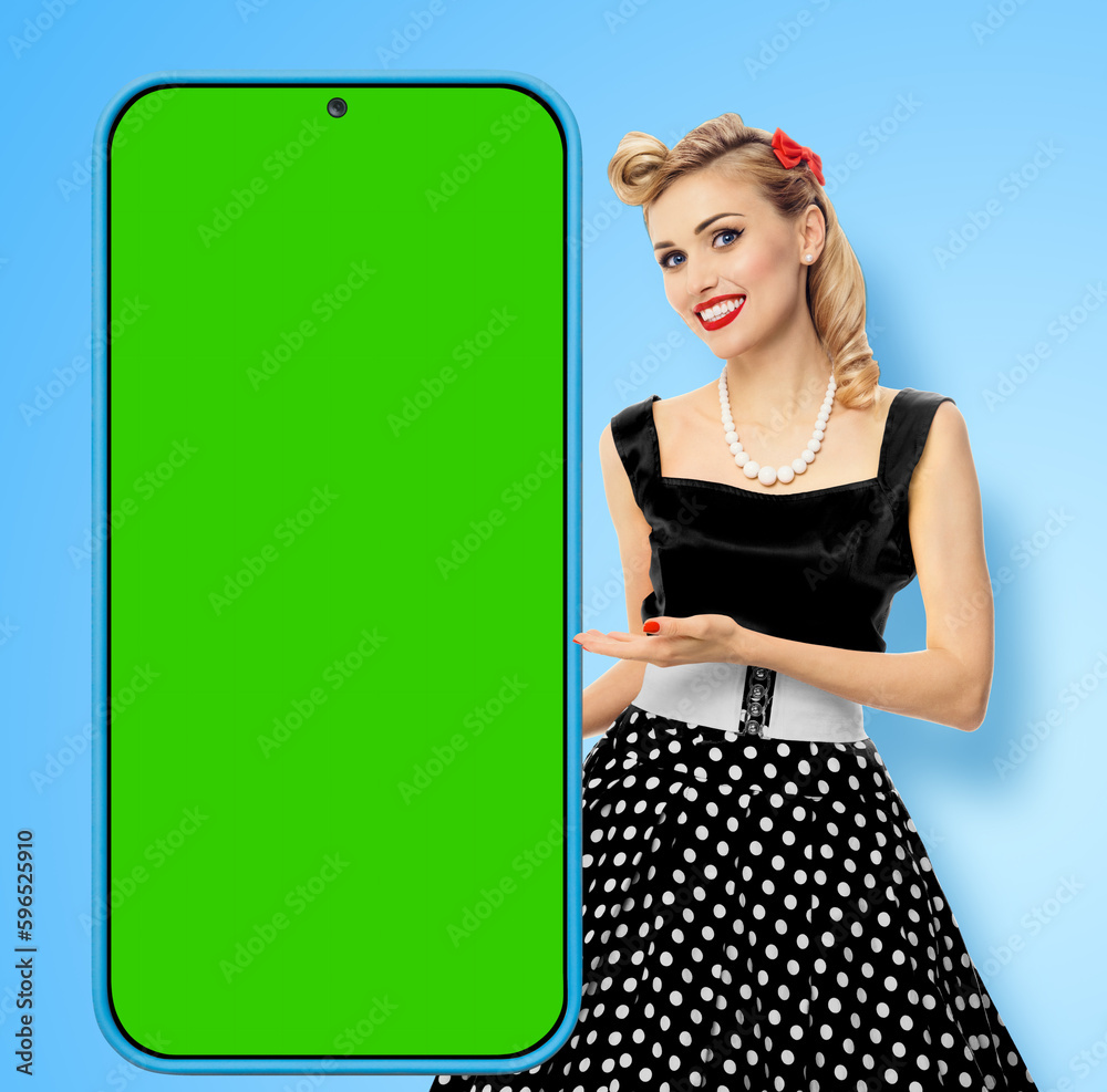 Beautiful woman in pin up cloth wear, show big cell phone, mobile ...