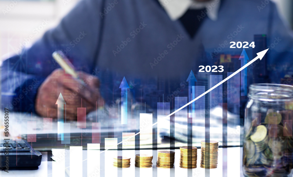Investment planning graph growth 2023 and 2024 with stack of coins and ...