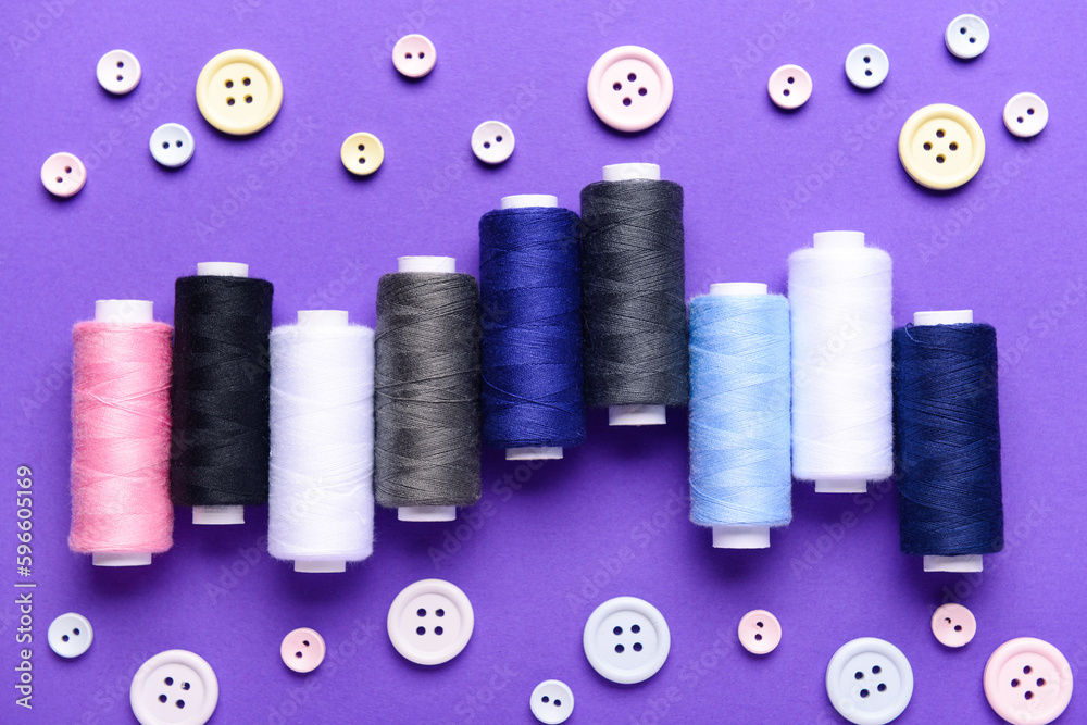 Composition with different thread spools and buttons on color ...