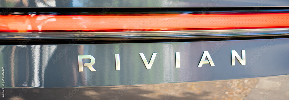 Panorama rear view futuristic-looking RIVIAN branding text of brand-new ...