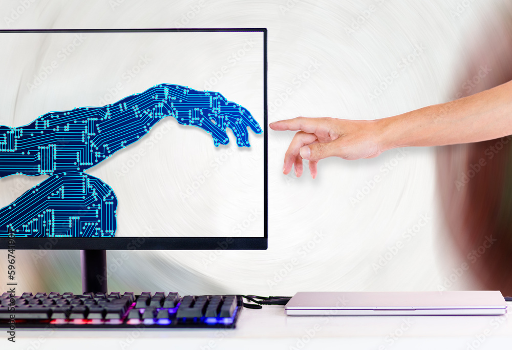 A person's finger touching a robot's finger on a computer screen ...