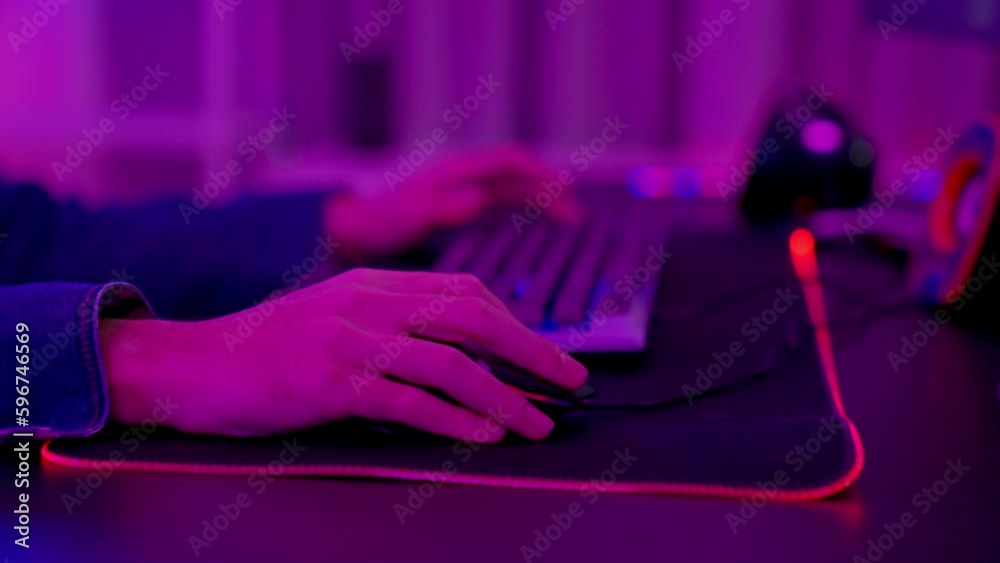 RGB neon light. finger tapping on neon backlit gaming mouse, cybersport ...