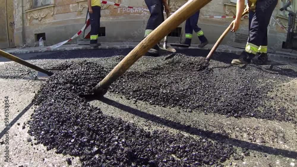 Group of Road Construction Workers Shoveling Fresh Asphalt. Teamwork on ...