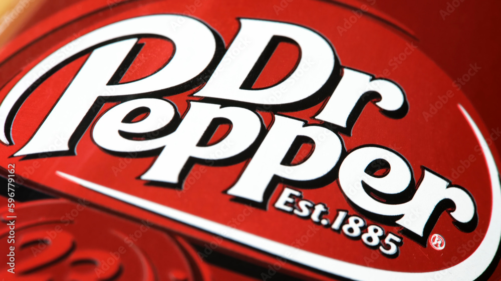 Dr. Pepper carbonated soft drink logo on a aluminum can rolling in ...