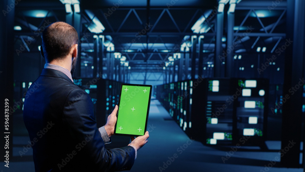 Foto de Database admin analyzing greenscreen display on tablet, doing web system check in server ...