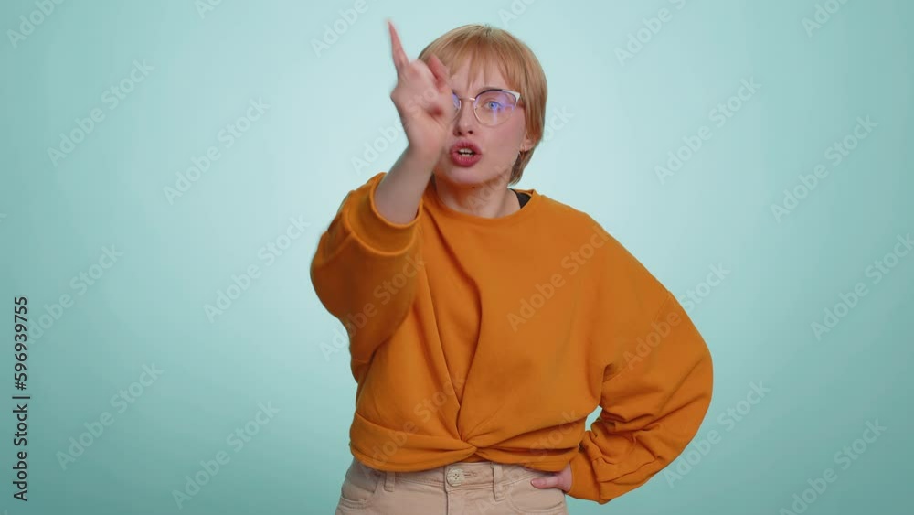 Quarrel. Displeased young woman gesturing hands with irritation and ...