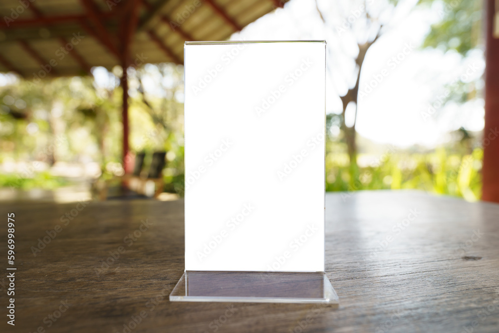 Mock up Menu frame standing on wood table in Bar restaurant cafe. space ...
