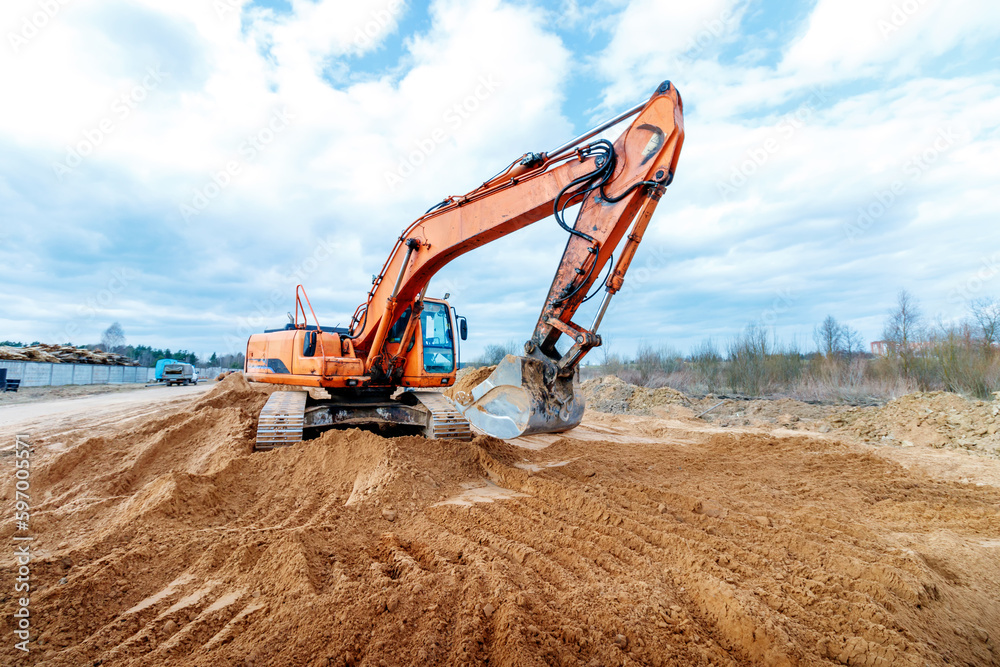 Excavator dig the trenches at a construction site. Trench for laying ...
