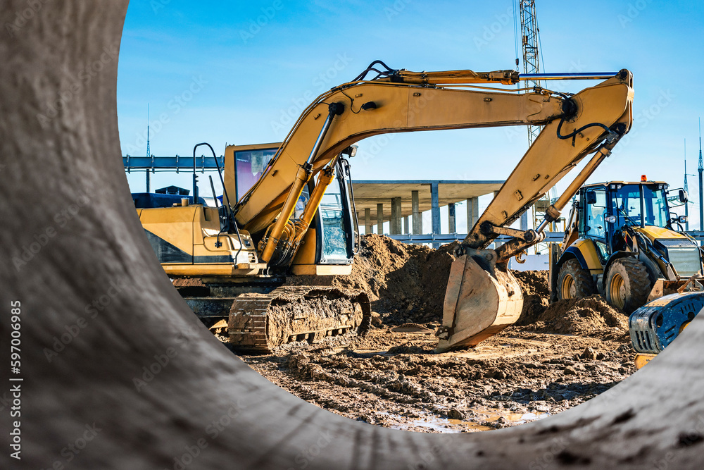 Yellow crawler excavator at the construction site. Earthworks at a ...