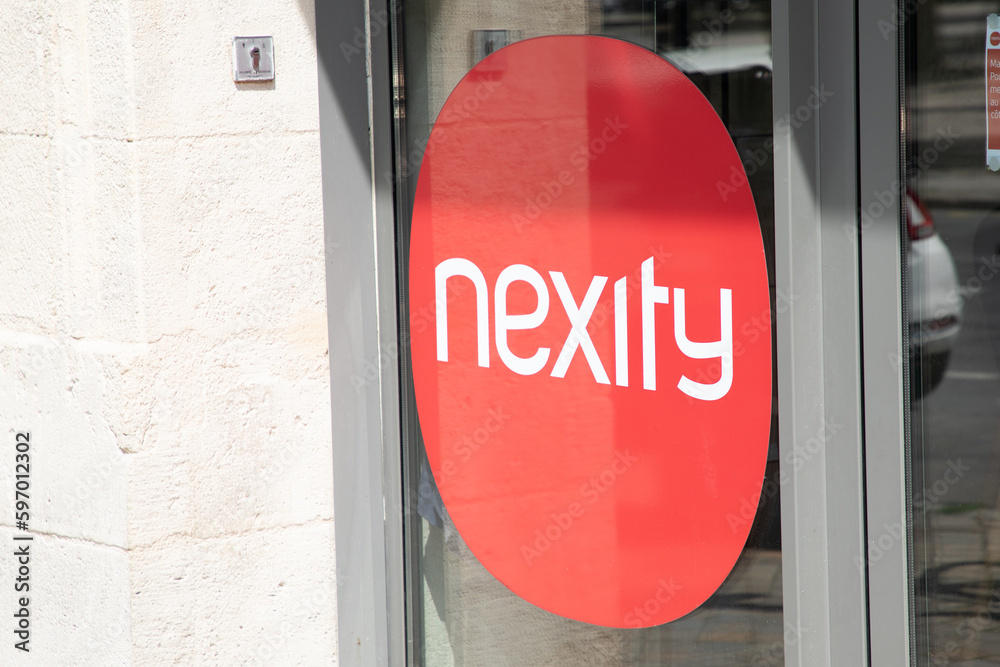 Nexity logo text and sign brand wall facade front of office French ...