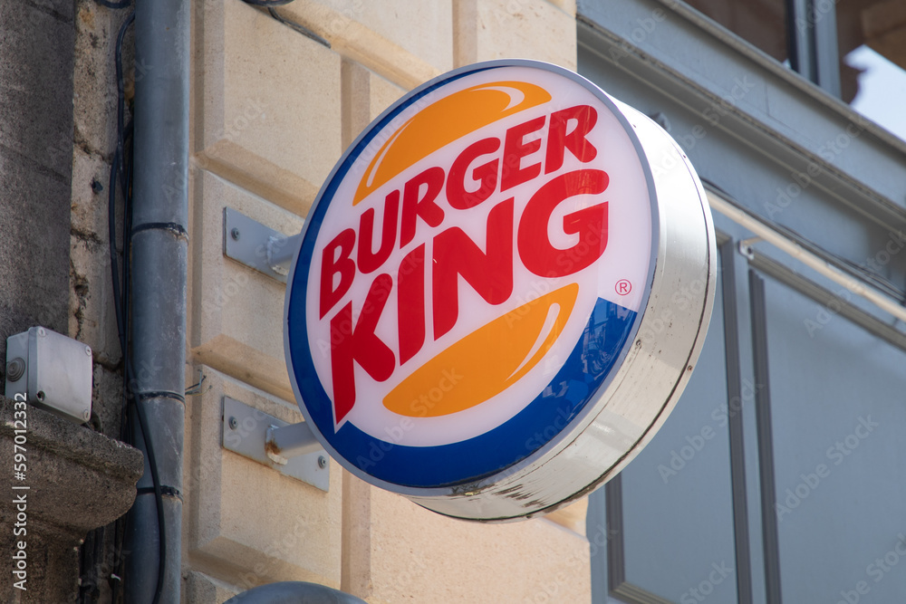 Burger King logo text and brand sign wall facade entrance restaurant us ...